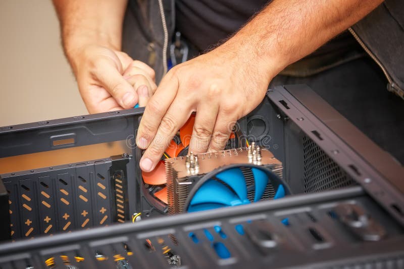 Computer Technician Installs Cooling System of Computer. Stock Photo ...