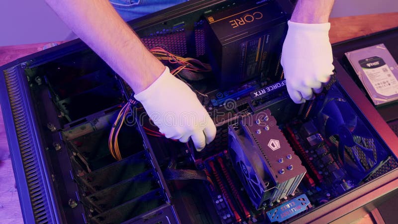 Computer Technician Installing Hard Disk Close Up in PC Case. . Minsk ...