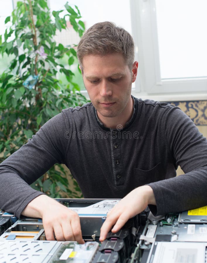 Man working on a computer stock photo. Image of work - 21373658