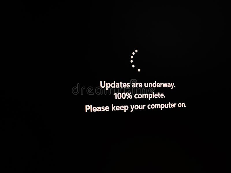 Computer Update Screen with Progress Message and Loading Symbol Stock ...