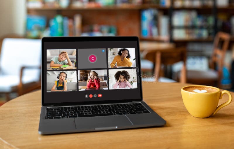 Computer with Video Chat Online Class Screen on Cafe Table Stock Image ...
