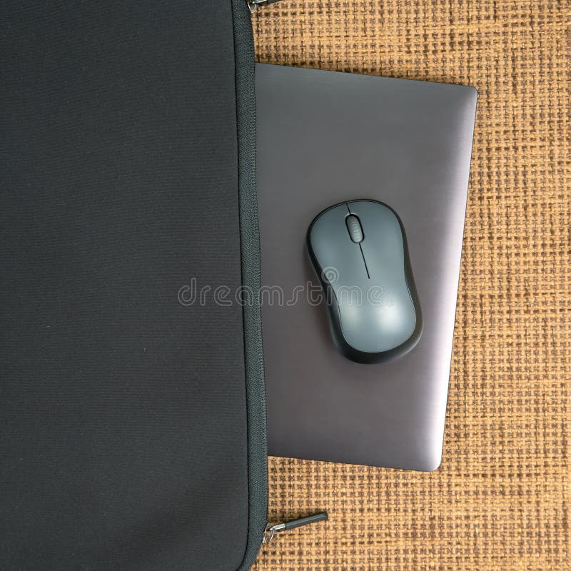 Computer Wireless Mouse Next To a Laptop on a White Table Close-up ...