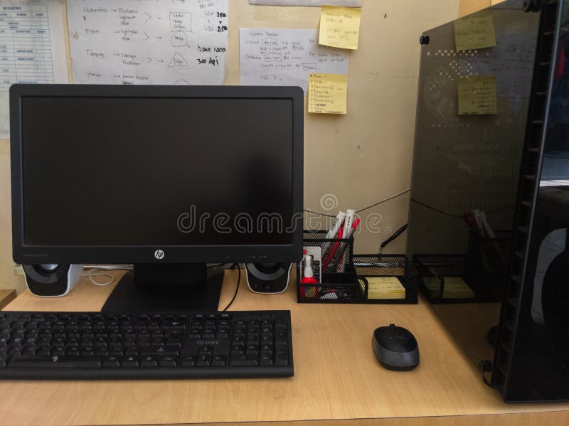 Computer And Work Desk With Lots Of Stickers On The Wall Editorial ...