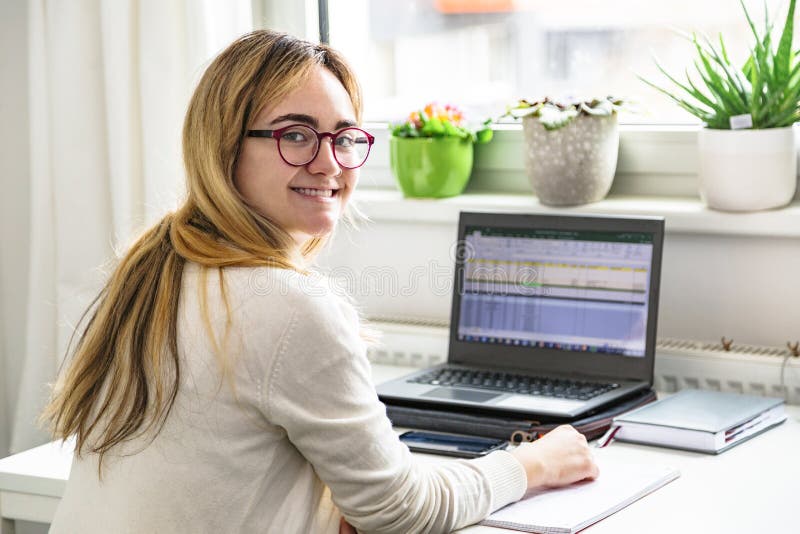 Girl at Laptop Turned Around and Looks at Camera Stock Photo - Image of ...