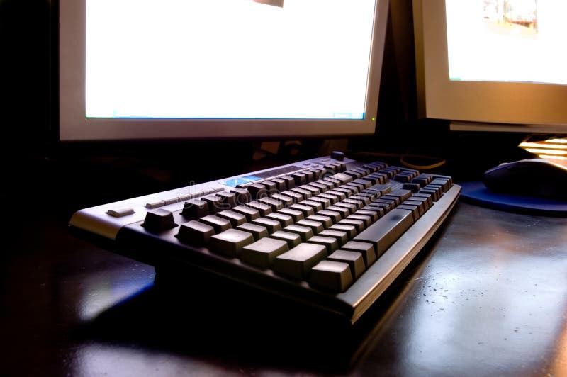 Computer Workstation with Two Monitors on Metal Top Desk Stock Photo ...