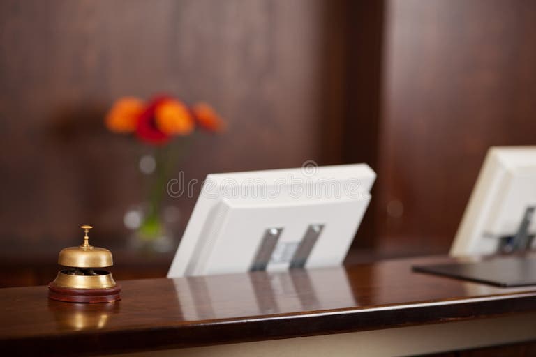 Computers and Bell at Reception Counter Stock Image - Image of checkin ...