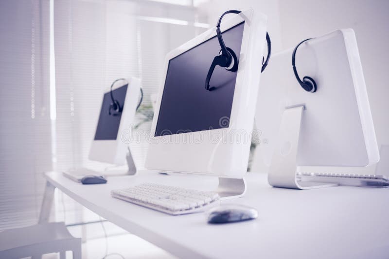 Computers and Headsets from a Call Center Stock Image - Image of office ...