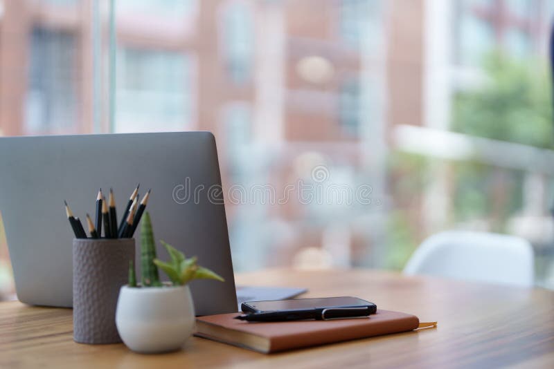 Computers and Mobile Phones are Placed at the Desk during Lunch Breaks ...