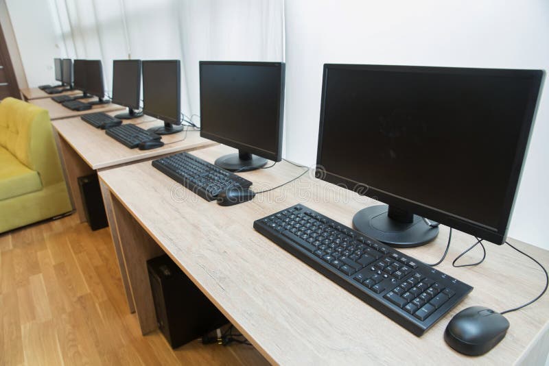 Two Computers and a Desk . Keyboard and Mouse . Two Computer Monitors ...