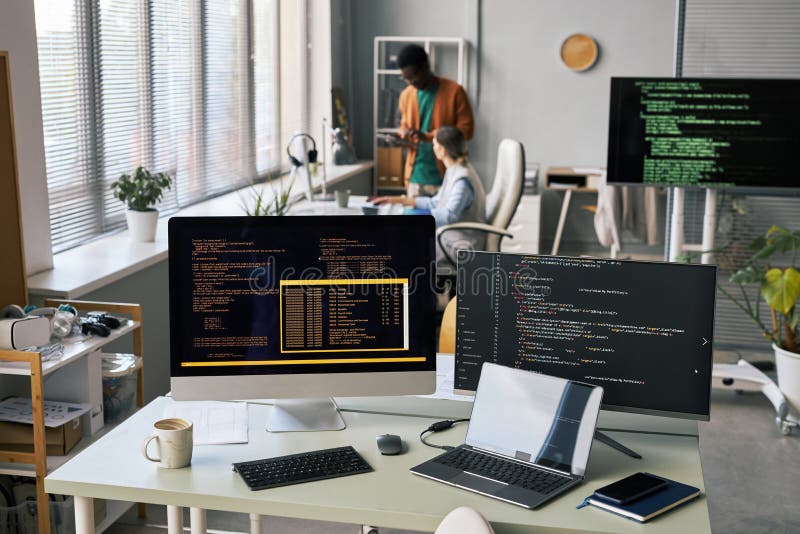 Computers with Code on Screen in it Programmers Office Stock Photo ...