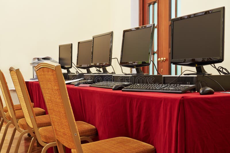 Computers on table editorial photo. Image of desk, graphics - 32655986