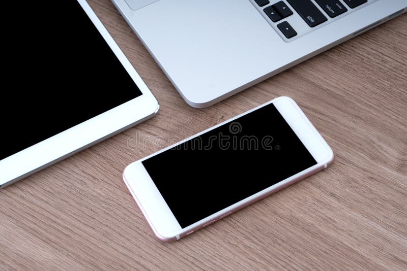 Computers and Tablets and a Mobile Phone on the Desk Stock Image ...