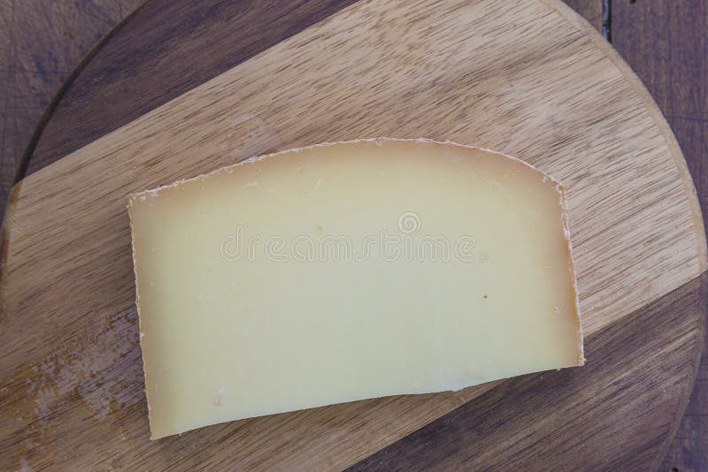 Comte Cheese on Wooden Cutting Board. Top View Stock Image - Image of ...