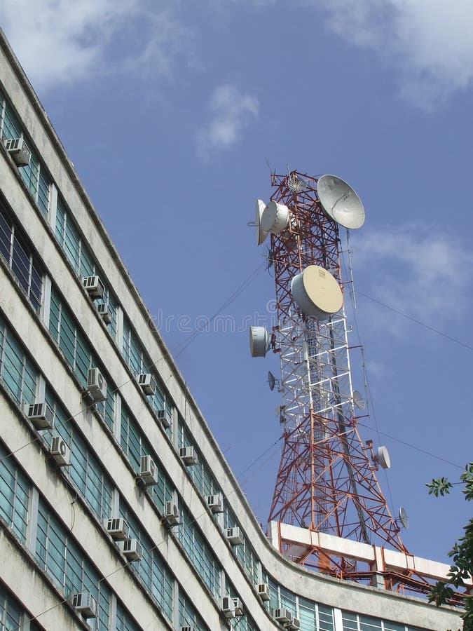 Comunications Tower Over a Building Stock Photo - Image of radar ...