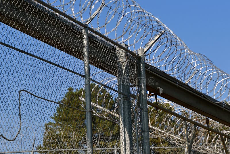 Concentina Wire and Prison Fence Stock Photo - Image of link, barricade ...