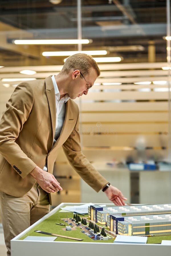 Concentrated Architect Man Working with Building Layout, Architectural ...