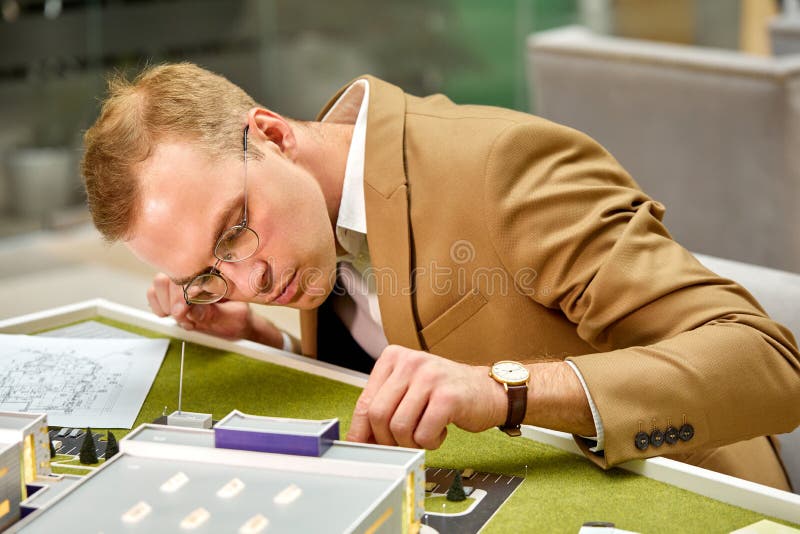 Concentrated Architect Man Working with Building Layout, Architectural ...