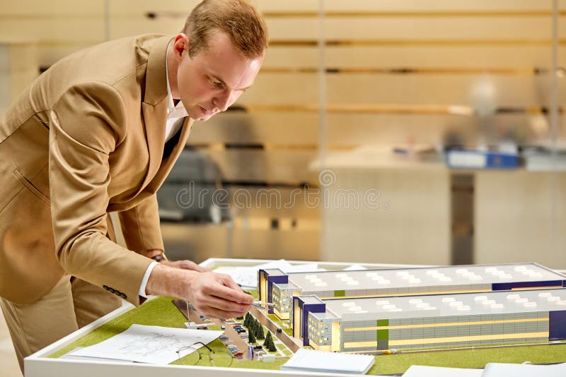 Concentrated Architect Man Working with Building Layout, Architectural ...