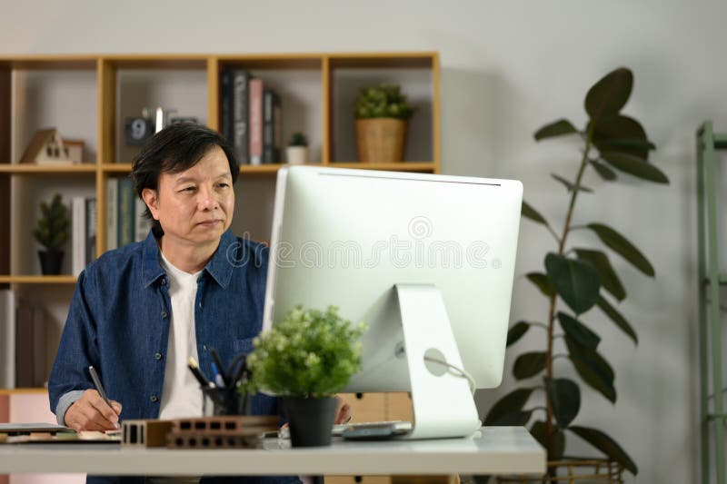 Concentrated Architect Men Looking at Computer Monitor, Working on ...