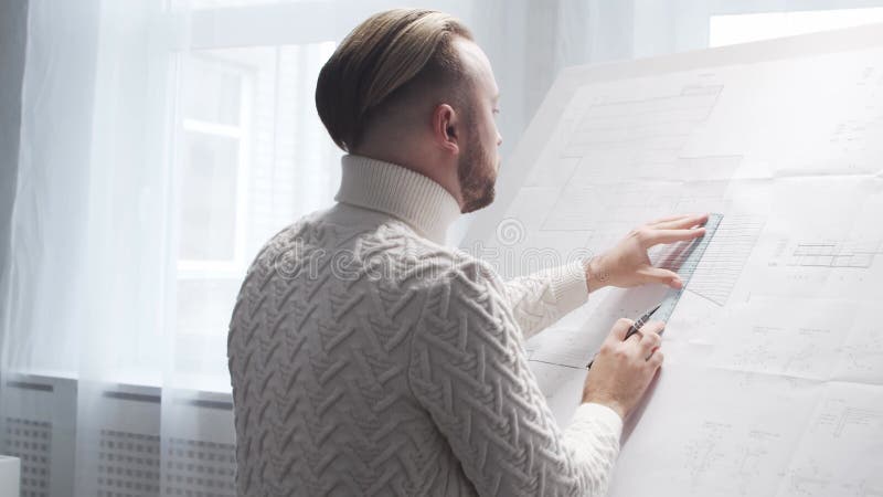 Architect Works in Loft Using Drawing Board. Workplace of Young and ...