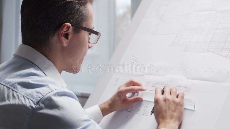 Architect Works in Loft Using Drawing Board. Workplace of Young and ...