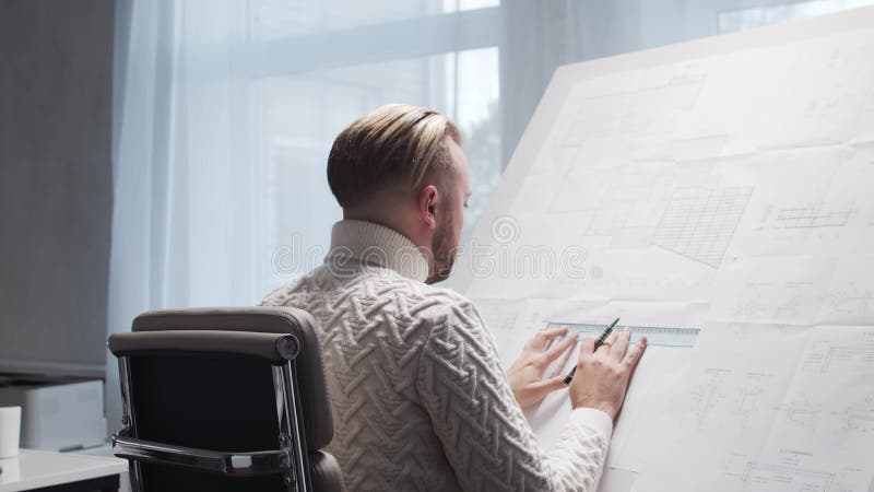 Architect Works in Loft Using Drawing Board. Workplace of Young and ...