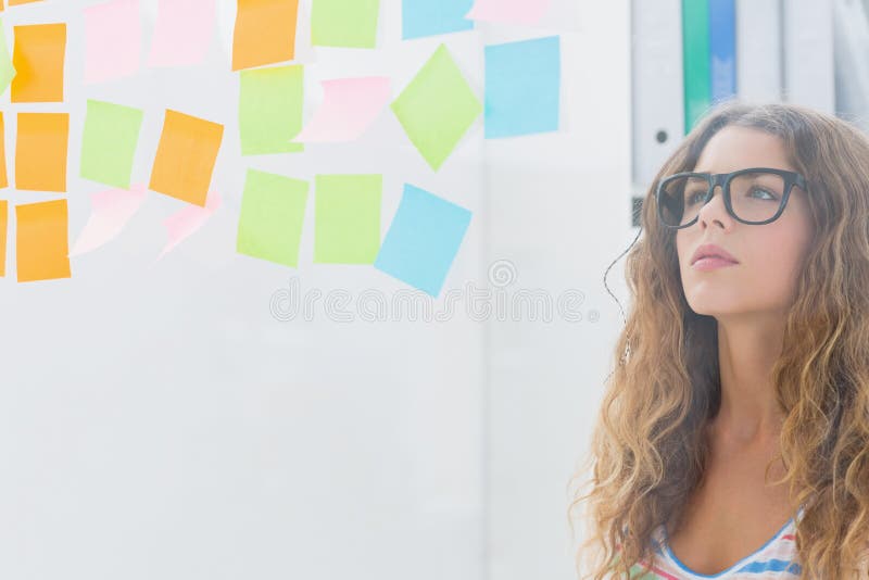 Concentrated Artist Looking at Colorful Sticky Notes Stock Image ...