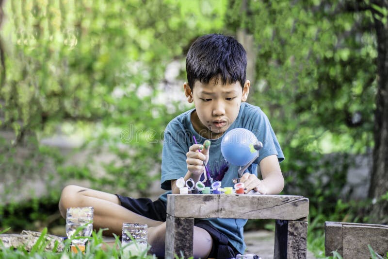 Concentrated Asian Boy Coloring Solar System Toys, Sensory Activity ...