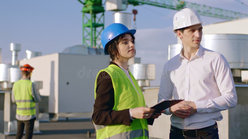 In Front of the Camera Attractive Lady Engineer Smiling Large on the ...