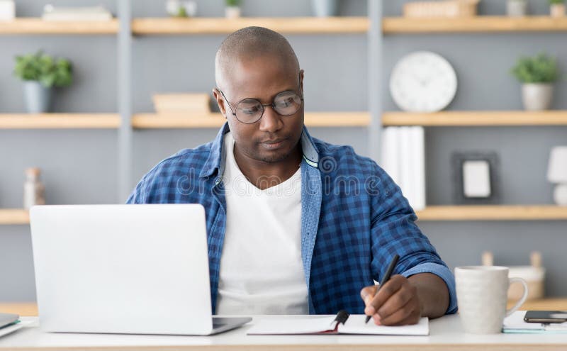 Concentrated Black Mature Man Attending Online Training from Home in ...