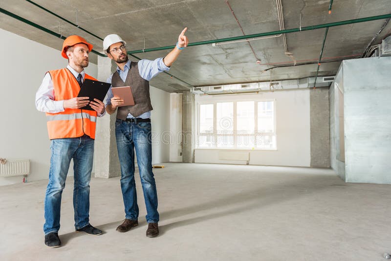 Concentrated Builders Keeping Important Documents Stock Photo - Image ...