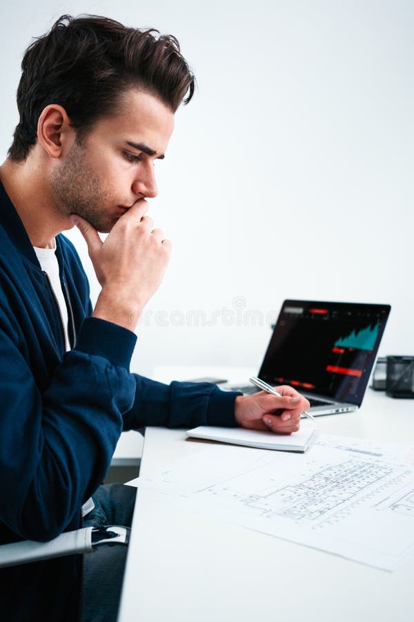 Concentrated Building Designer Working with Drawing Plan and Computer ...