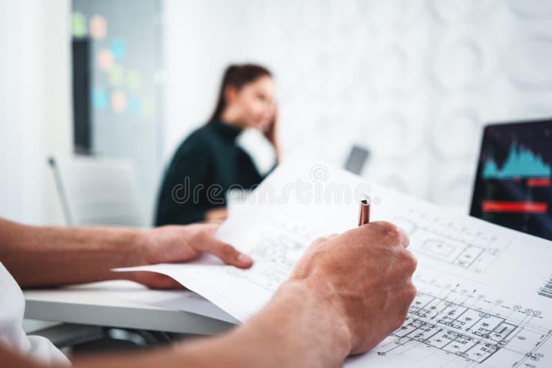 Young Team of Architect Using Laptop and Blueprint Project Stock Photo ...