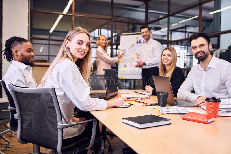 Concentrated Business People Communicating with Each Other while ...