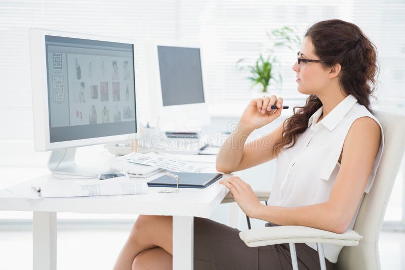 Concentrated Businesswoman Using Computer and Digitizer Stock Image ...