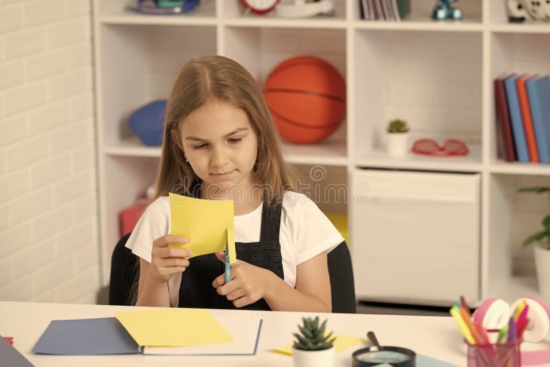 Concentrated Child Cut Paper in School Classroom Stock Image - Image of ...