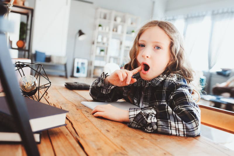 Concentrated Child Girl Doing Homework. Thoughtful School Kid Thinking ...