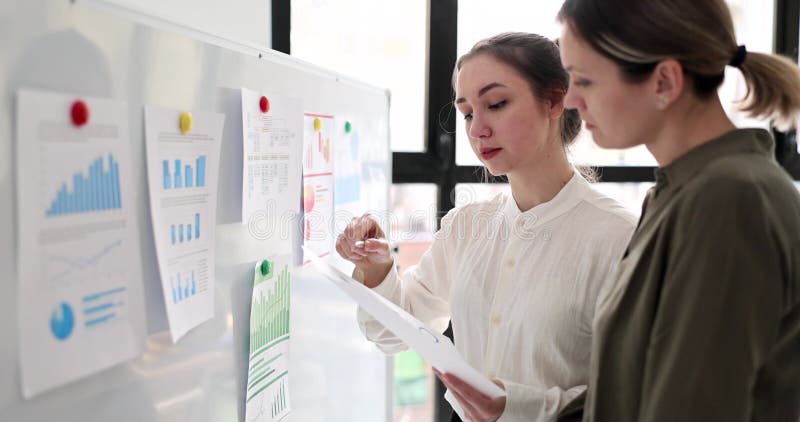 Concentrated Colleagues Compare Statistics Looking at Papers Stock ...