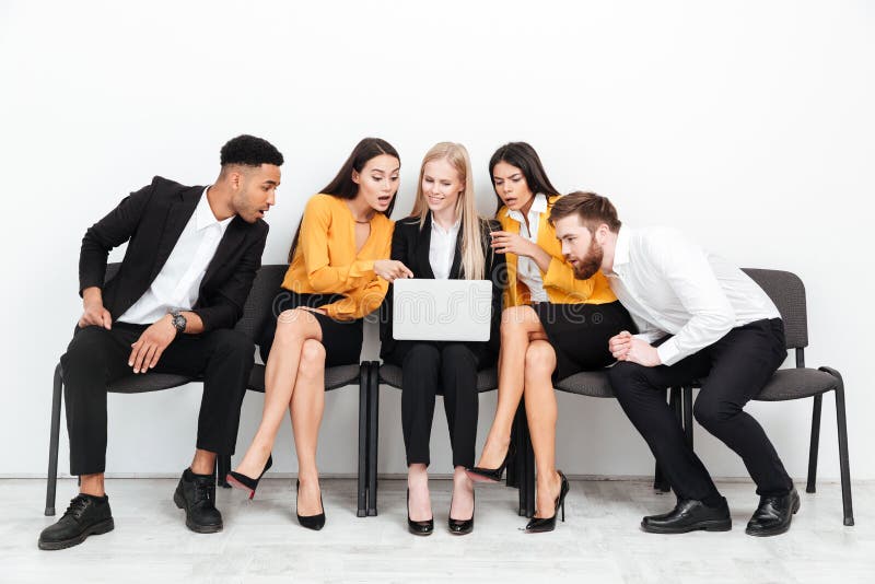 Concentrated Colleagues Sitting in Office Using Laptop Computer Stock ...