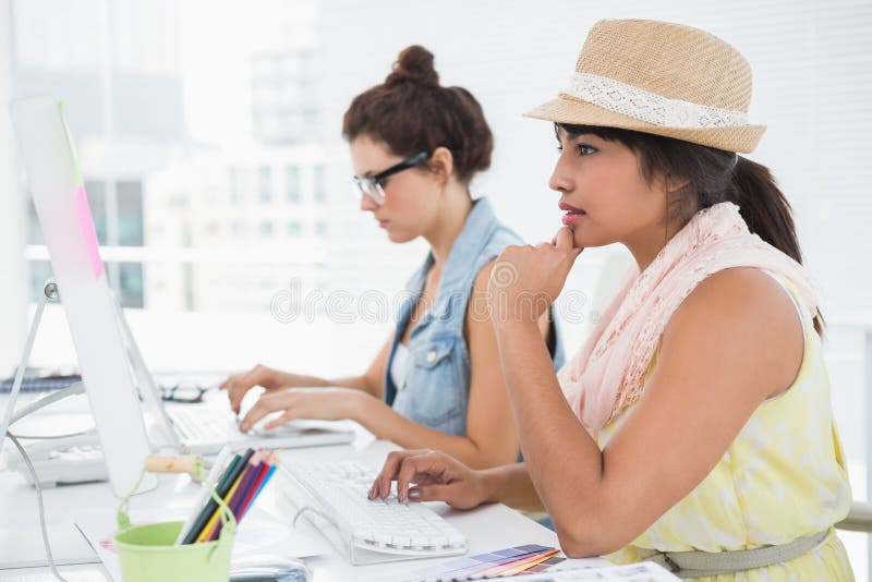Concentrated Colleagues Typing on Keyboard Stock Image - Image of ...