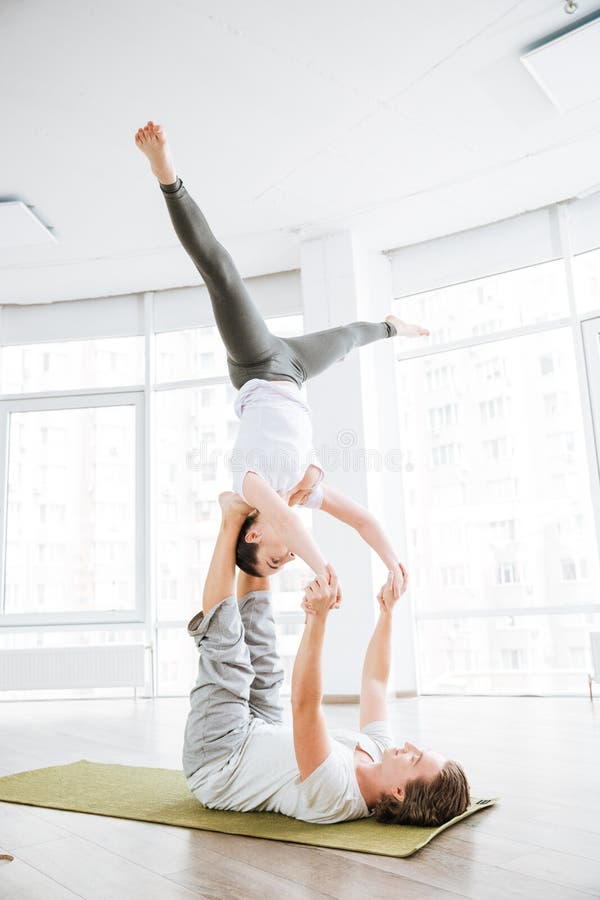 Concentrated Couple Practicing Acro Yoga Exercises Stock Image - Image ...