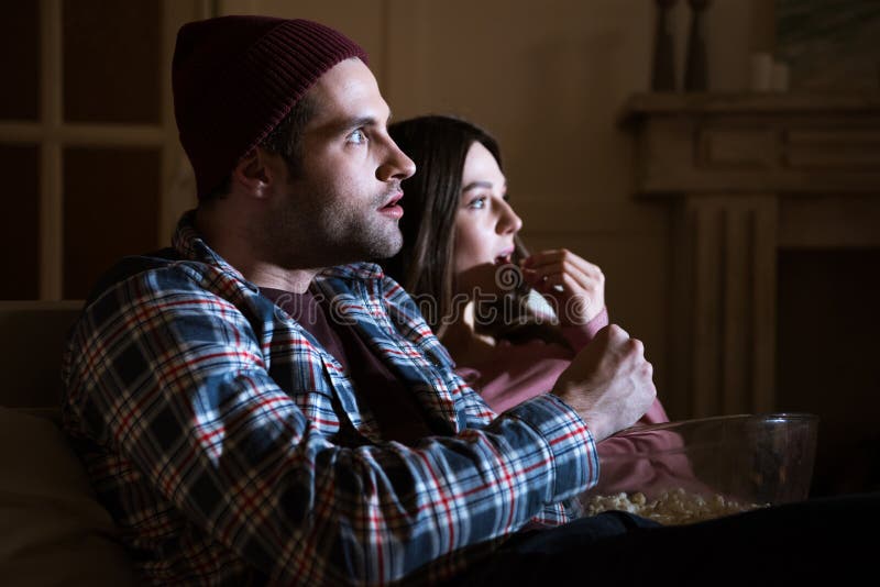 Concentrated Couple Watching Movie at Home Stock Image - Image of ...