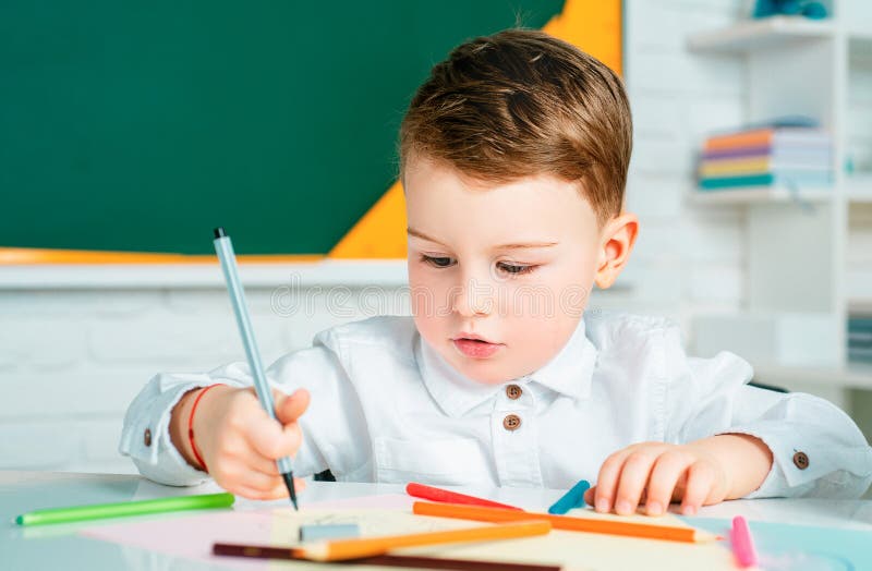 Concentrated Cute Child, Writing in Notebook Using Pencil. Cute Child ...