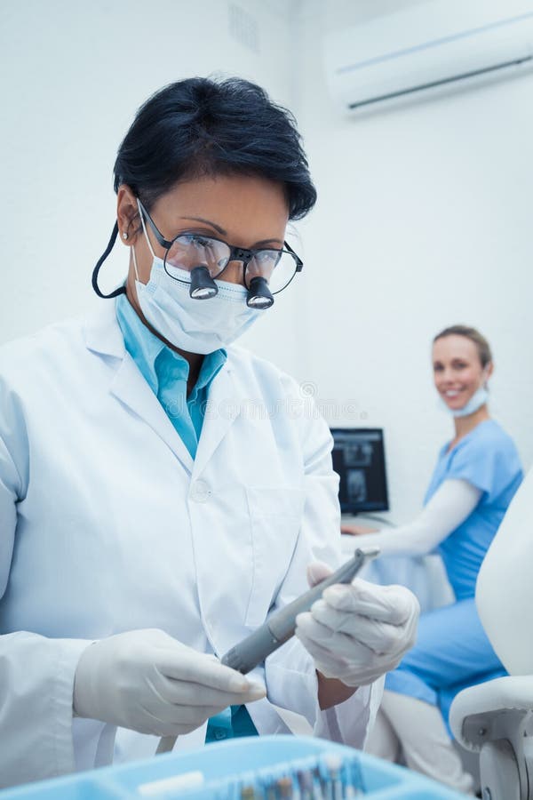 Concentrated Dentist Looking at Dental Tool Stock Image - Image of ...