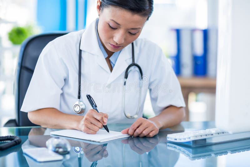 Concentrated Doctor Writing on Notebook Stock Photo - Image of chinese ...
