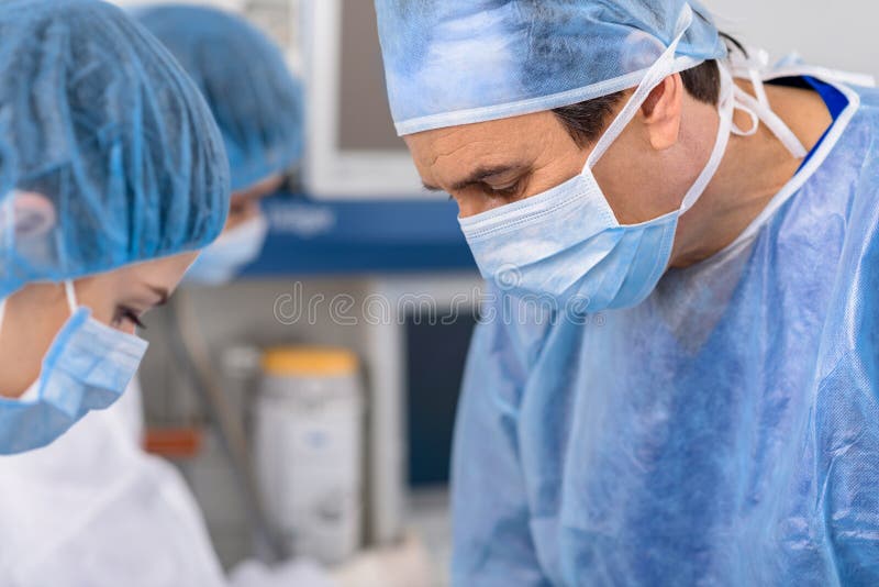 Concentrated Doctors at Operating Theatre Stock Image - Image of ...