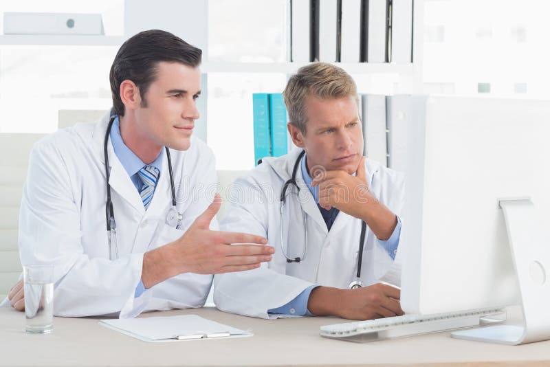 Concentrated Doctors Working with Computer Stock Image - Image of ...