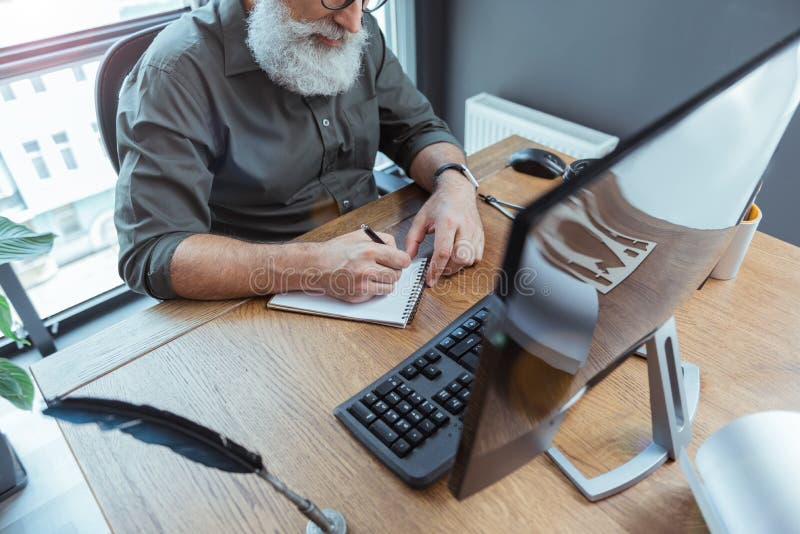 Concentrated Elderly Man is Noting His Ideas Stock Image - Image of ...