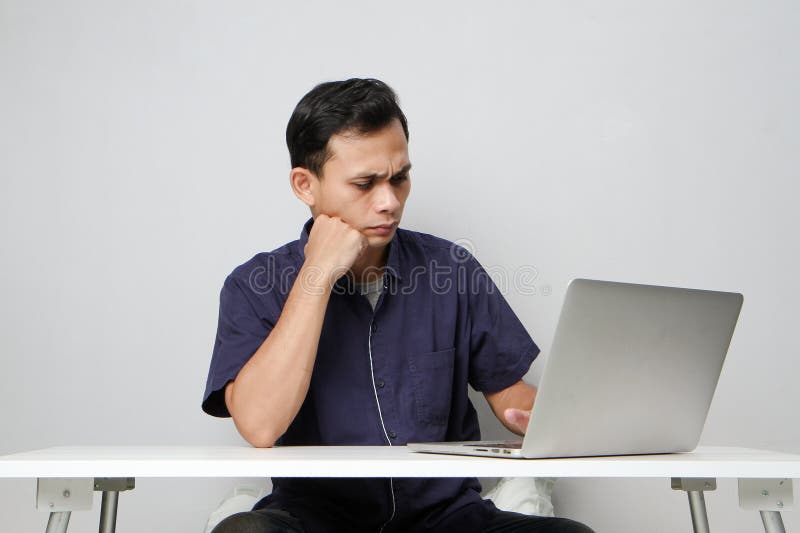Concentrated Face of Asian Man while Sitting in Front of Laptop ...