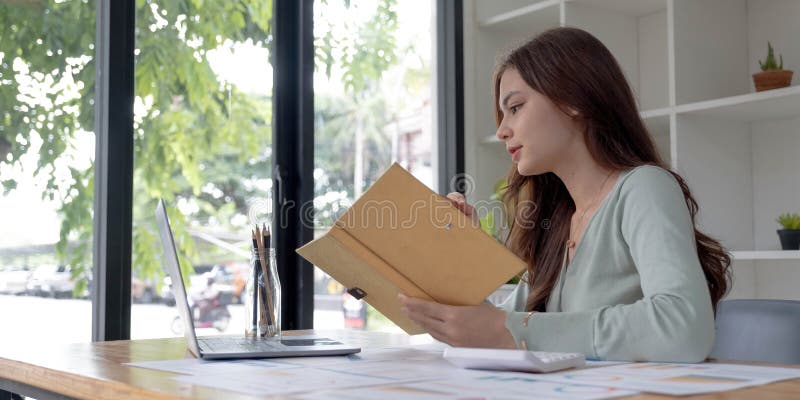 Concentrated Female Student Busy Studying Using Laptop Make Notes in ...